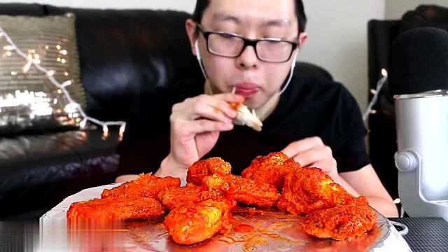 Look at this chicken wing that the guy is eating? The red one is very ...