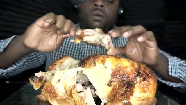 The black brother eats the whole roast chicken, fresh and juicy, meaty ...